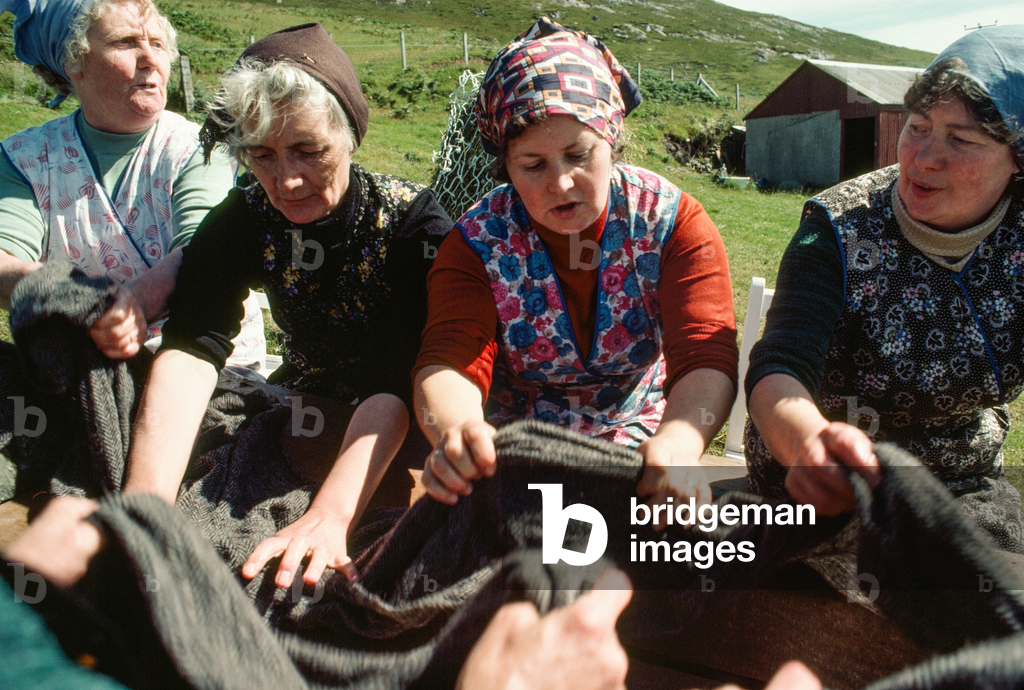 Image of Women demonstrate the traditional method of shrinking tweed ...