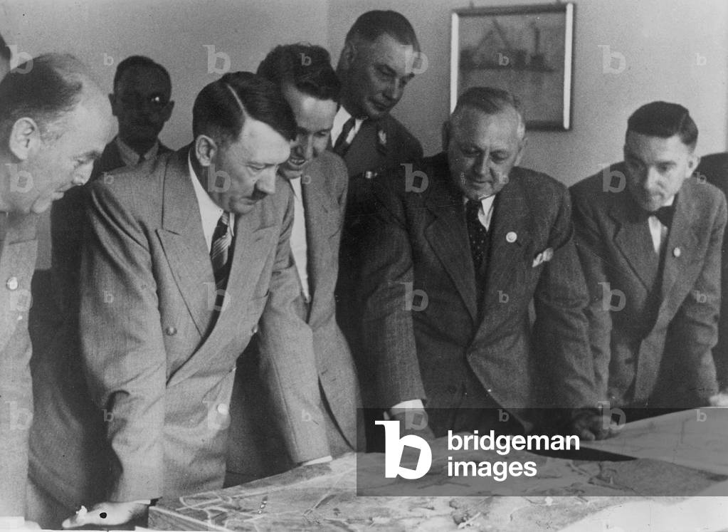 Image of Adolf Hitler visits models and plans for the redesign of