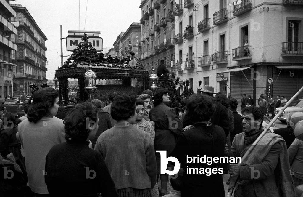 Image of A funeral procession follows a hearse with coachman, Naples, Italy
