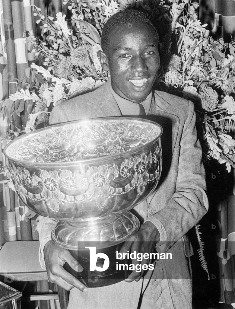 Image of A portrait of Stephen Muchoki, Kenyan boxer holding his huge