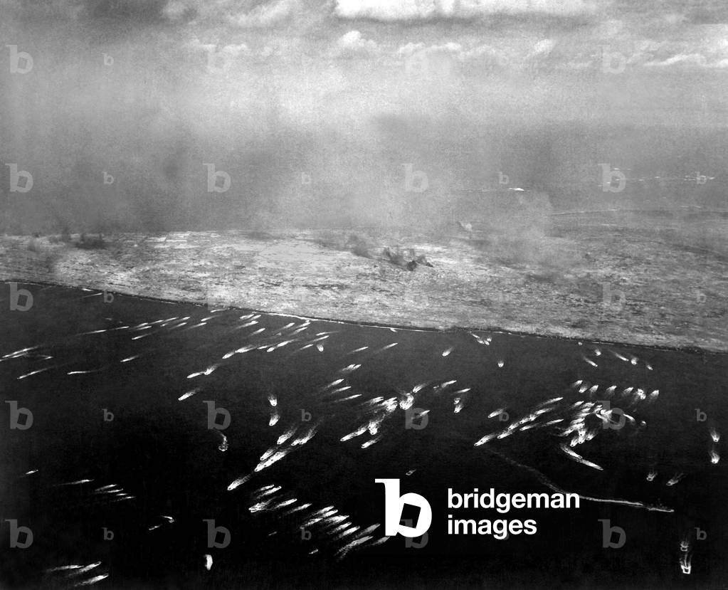 Image of Aerial view of the first wave of landing craft invading