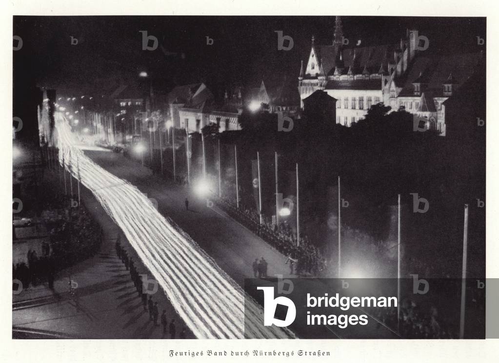 Image of Torchlit Nazi procession along the streets of Nuremberg, 1936 (b/w