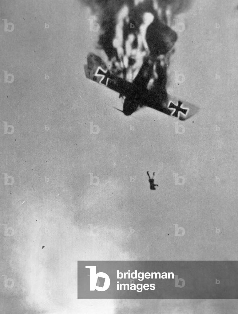 Image of Burning German aircraft plunges to earth with pilot falling to