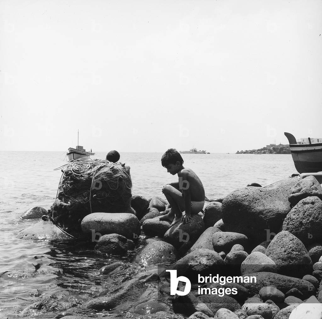 Image of Child on the rocks by the sea to Panarea (b/w by Maria Orioli ...