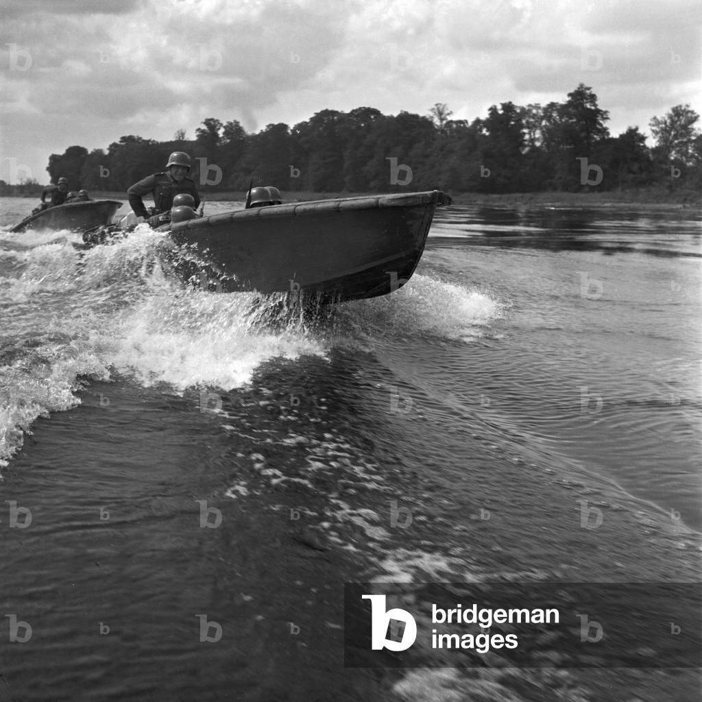 Image of Storm boat crossing a river, Germany 1940s (b/w photo)