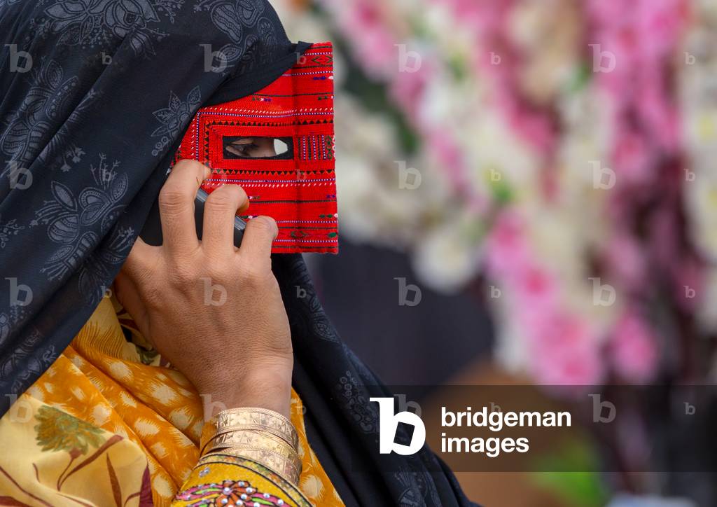 Image of A Bandari Woman Wearing A Traditional Mask Called The Burqa