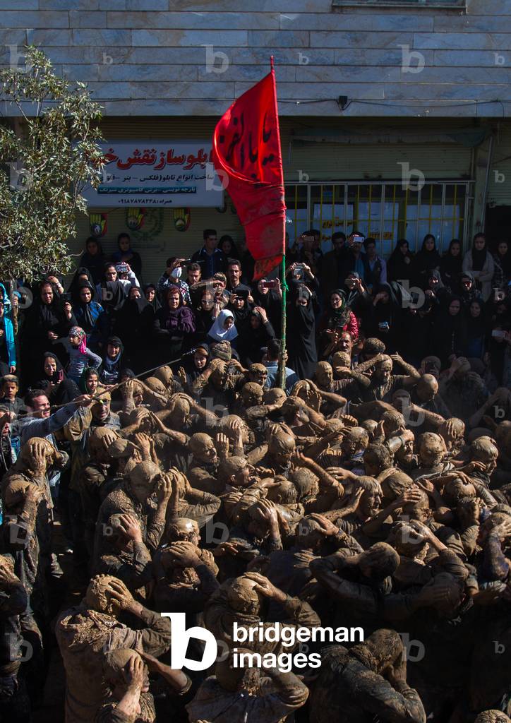 Image of Iranian Shiite Muslim Men Covered in Mud, Chanting and Self-flagellating