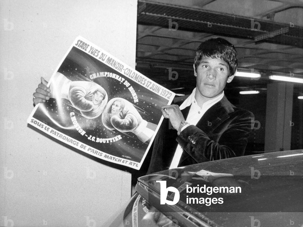 Image of Argentine Boxing Champion Carlos Monzon Presents The Poster Of His