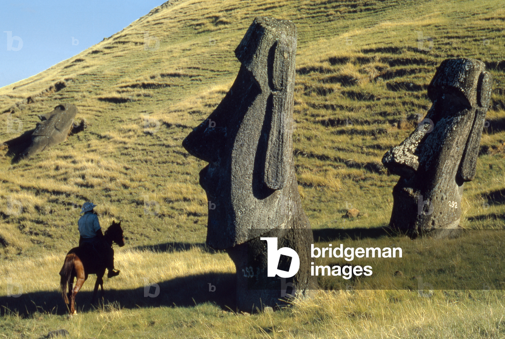 Image of Easter Island monoliths called moai in a volcanic landscape ...