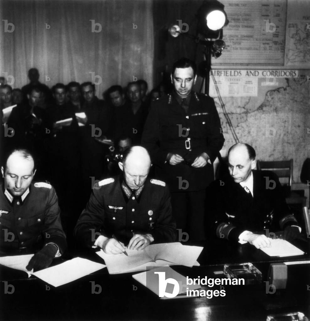 Image of Alfred Jodl (center), Nazi Chief of Operations Staff, signs ...