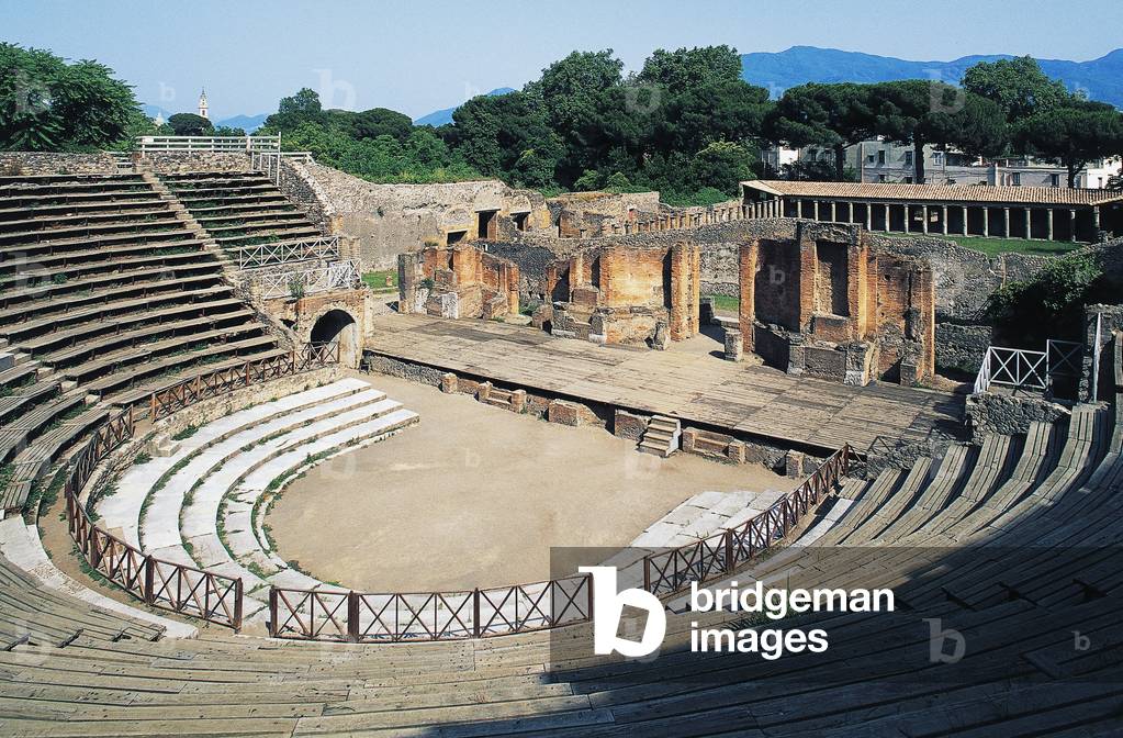 Image of Cavea (auditorium) of theatre with ruins and great portico of