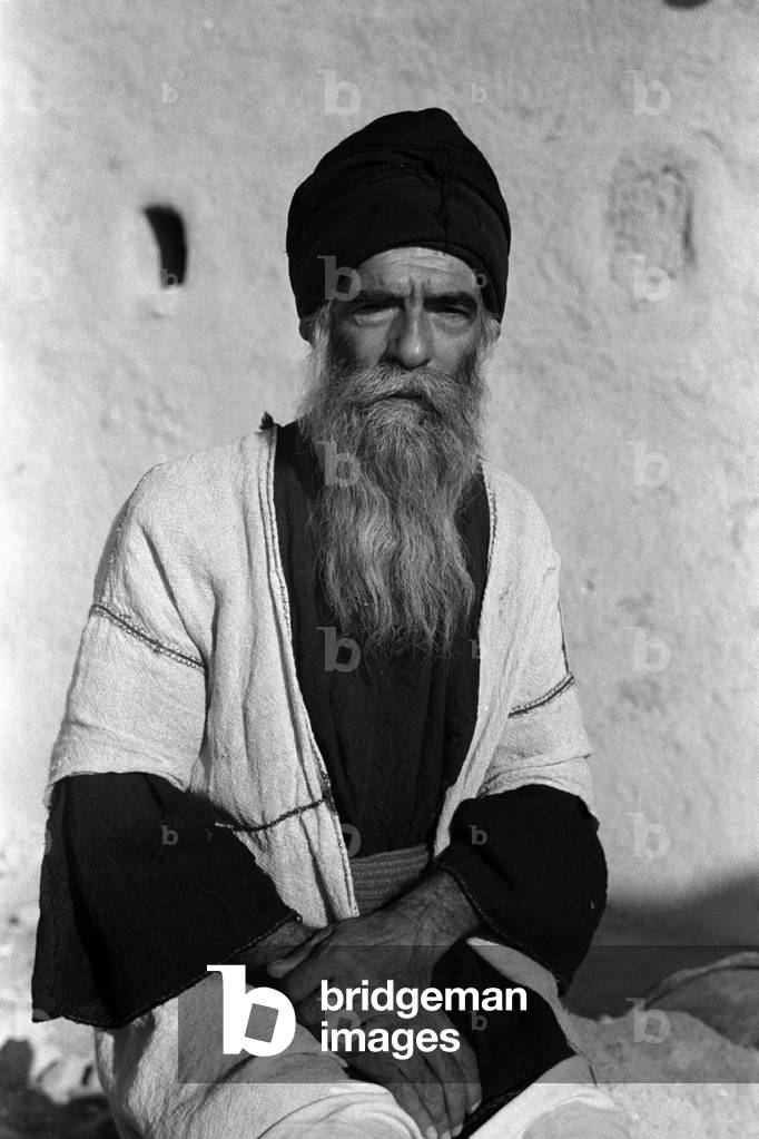 Image of Portrait of a Kurdish man, a fakir, sitting, wearing the by ...