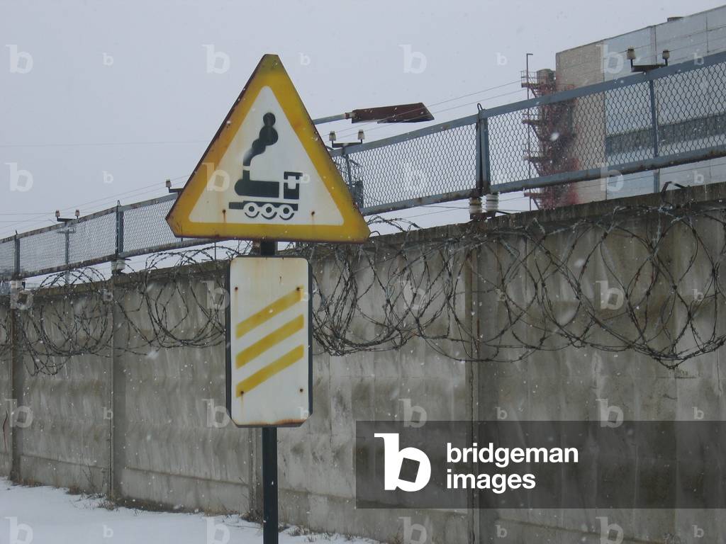 Image of Sign and barbed wire fence near Reactor No. 4 at