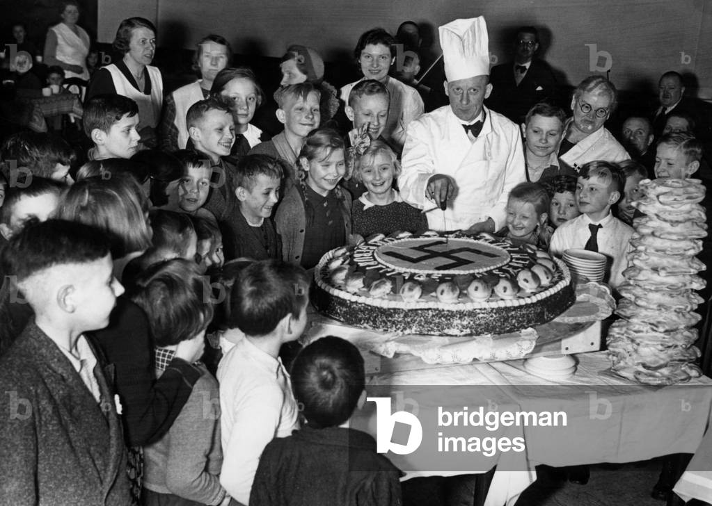 Image of Children in front of a birthday cake for Hitler in