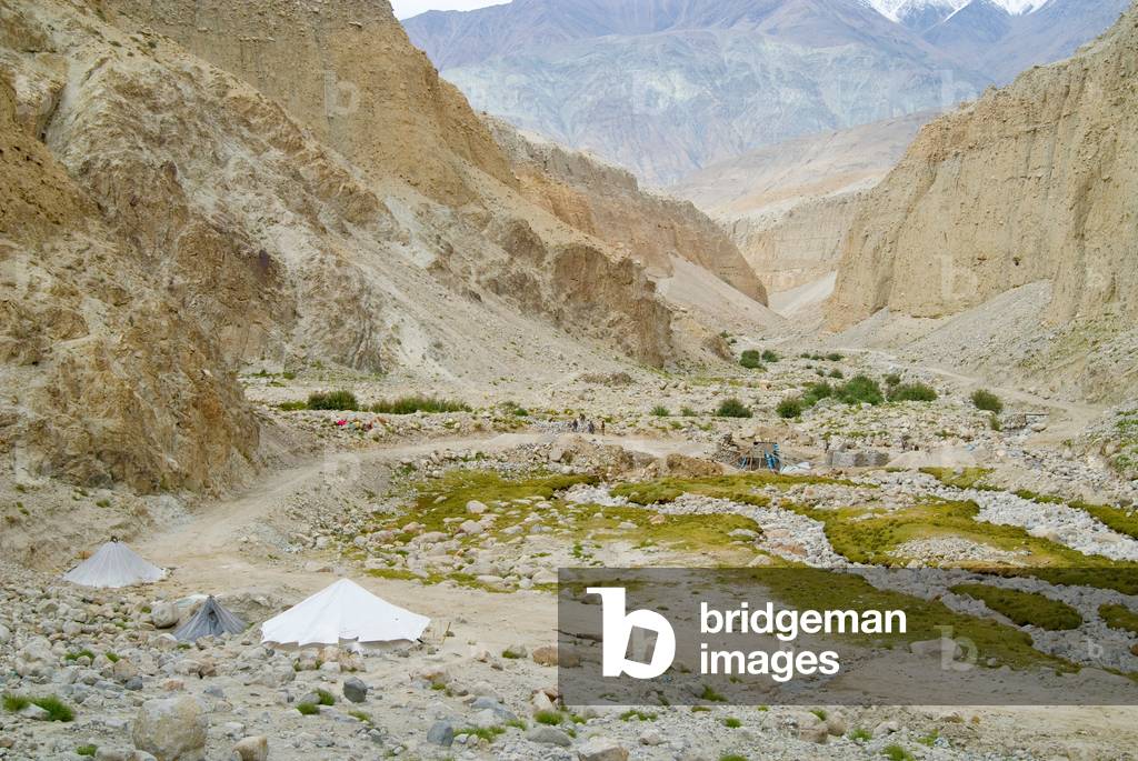 Image of Rough winding road & roadworks through narrow Himalayan gorge ...
