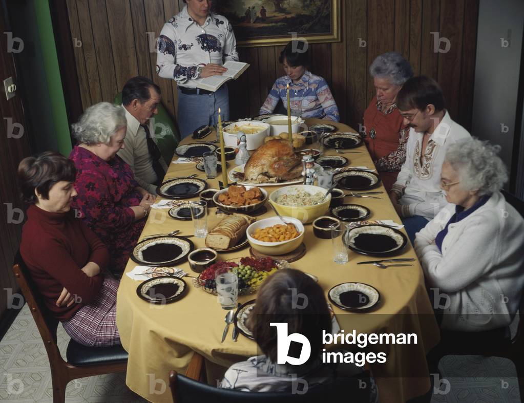 Image of Family praying at dining table on Thanksgiving Day, USA by ...