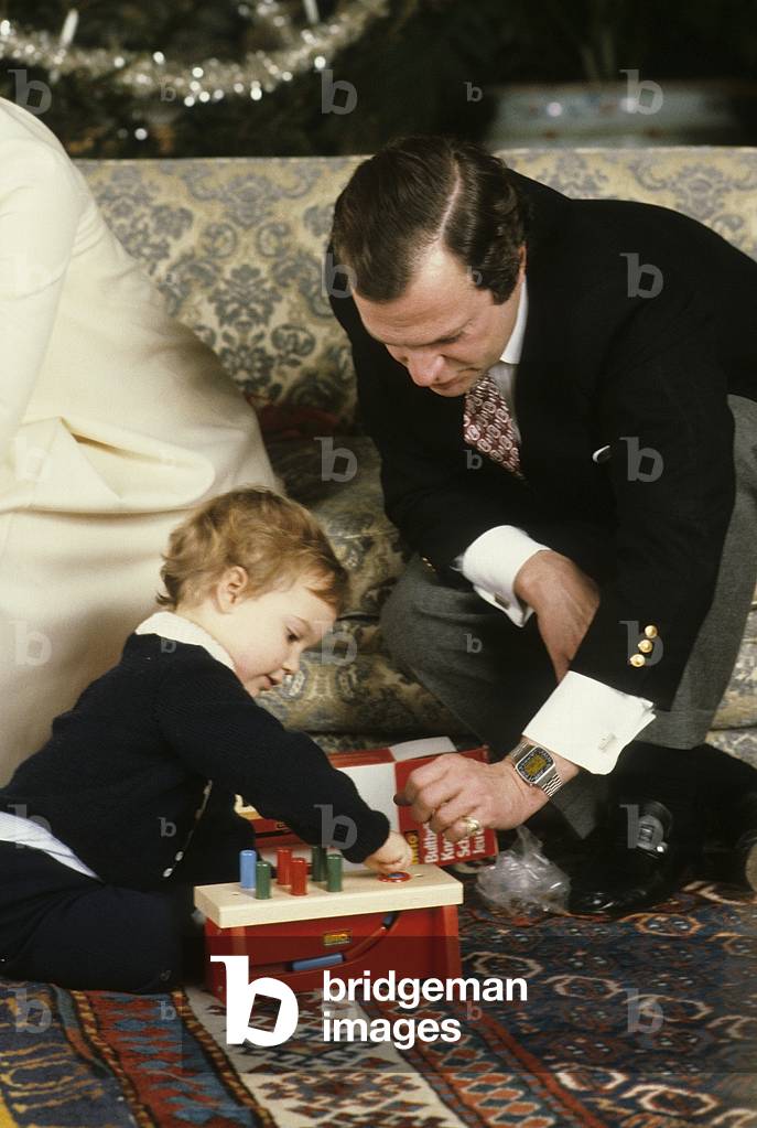 Image of Carl XVI Gustaf, King of Sweden, with his son prince