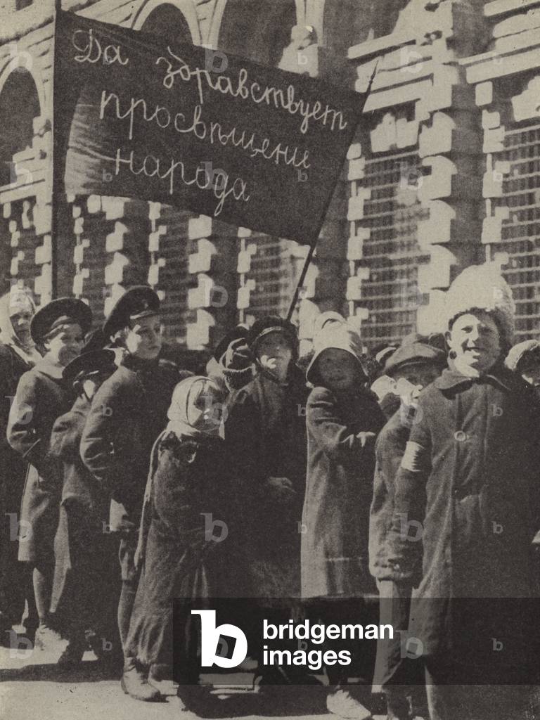 Image of Procession of Russian children carrying a banner reading 'Long ...