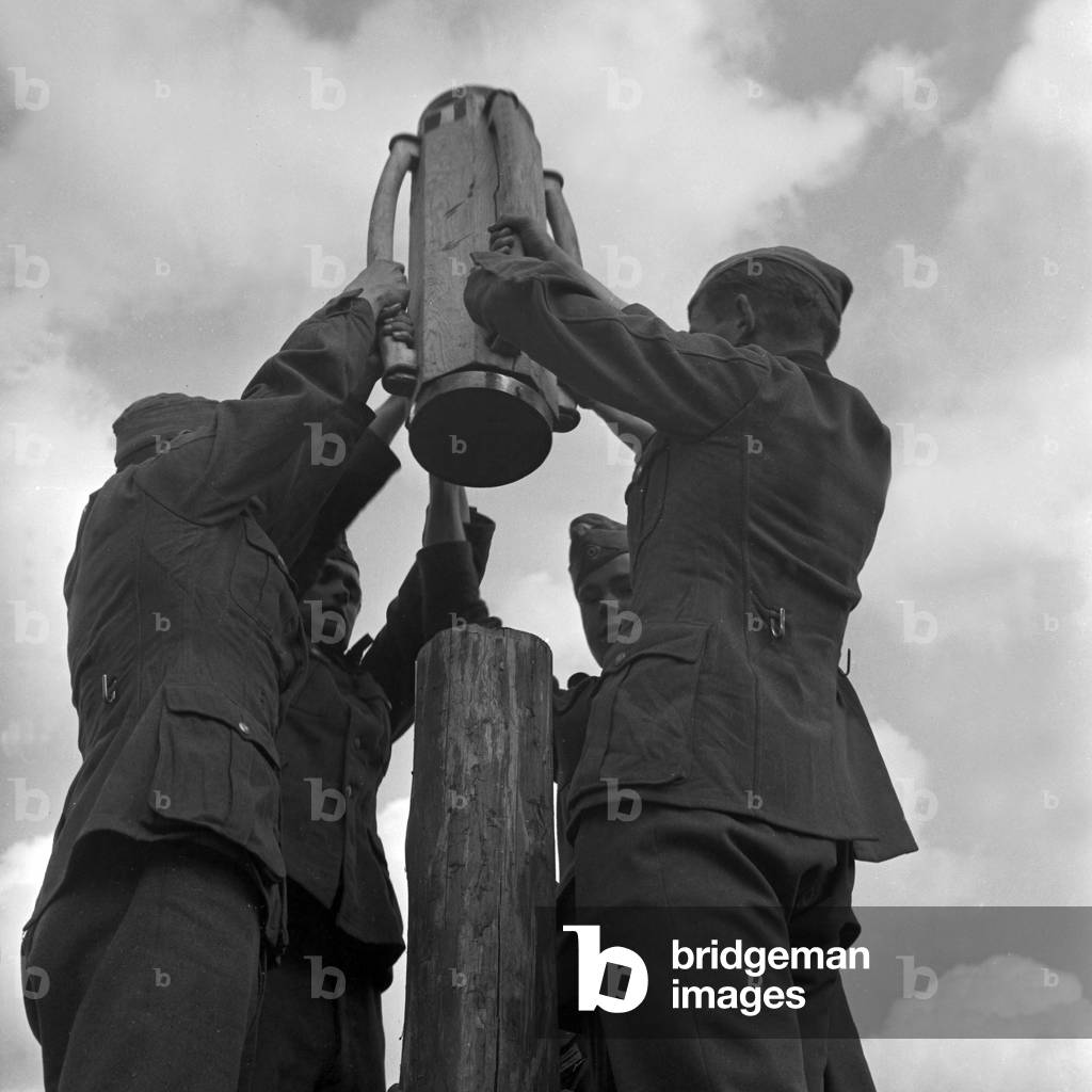 Image of Construction soldiers doing some pile driving, Germany 1940s ...