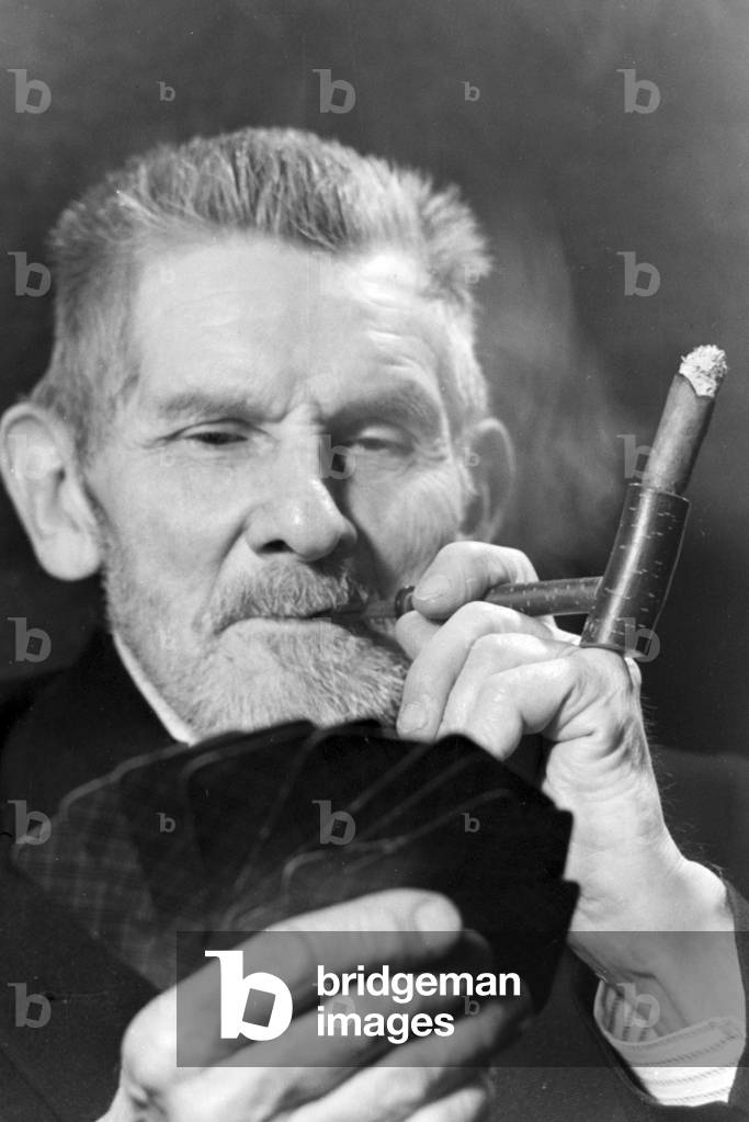 Image of A man smoking a cigar for an advertising campaign, Germany