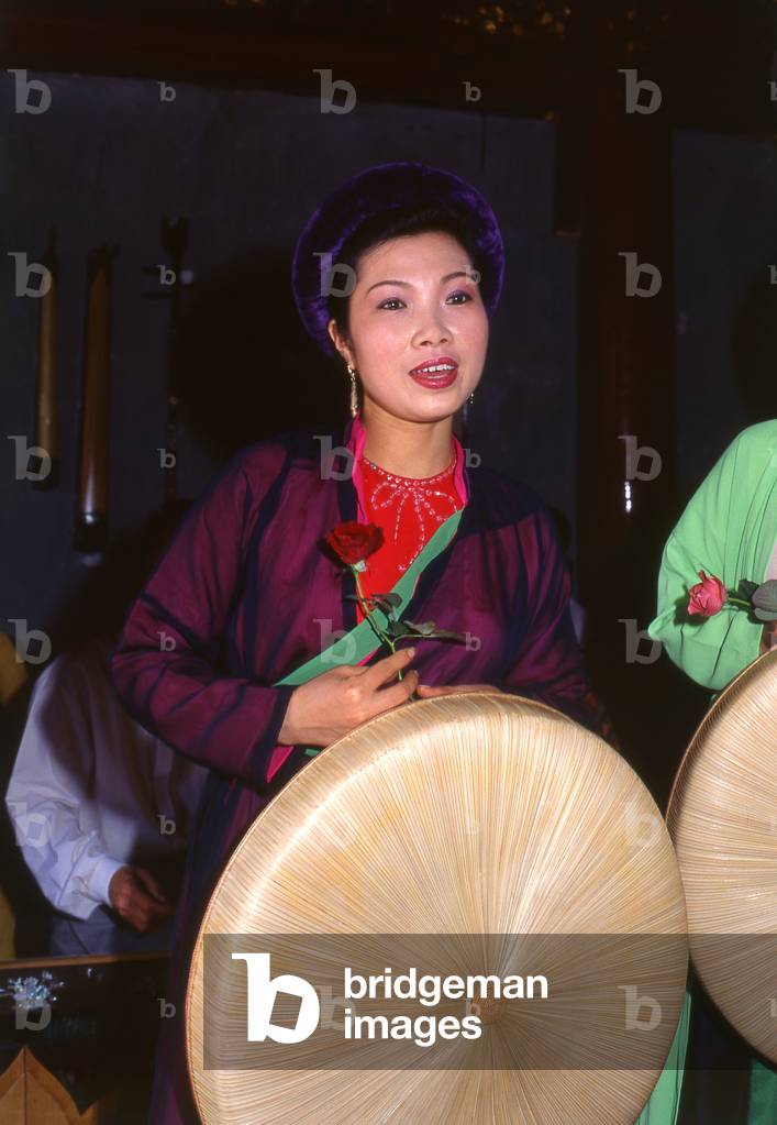 Image of Vietnam: Singer with a traditional Vietnamese orchestra at Van ...