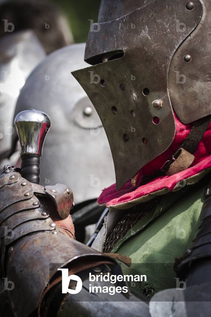 Image of Historical reenactment: Knight with armour and sword, 14th century