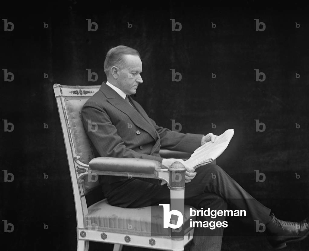 Image of U.S. President Calvin Coolidge, Portrait Reading Newspaper ...