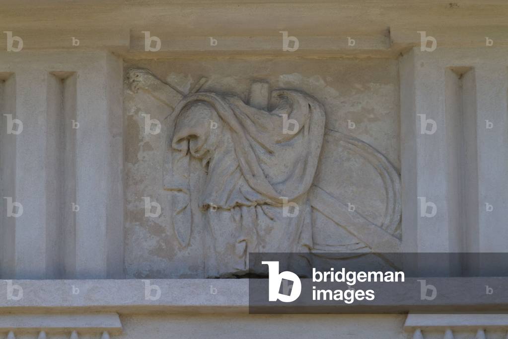 Image of Metope with bas-relief depicting robe, sword and shield ...