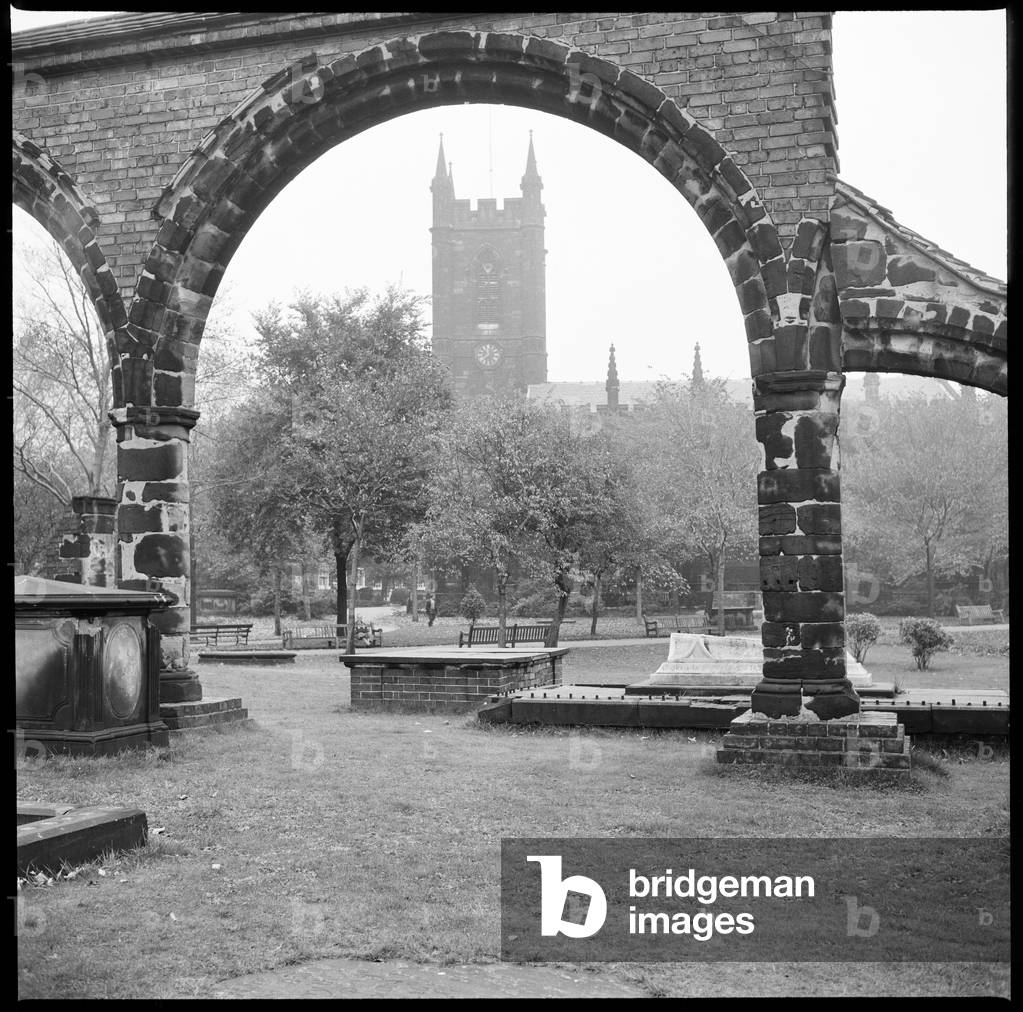 Image of St Peter's Church seen through the re-erected stone arches of