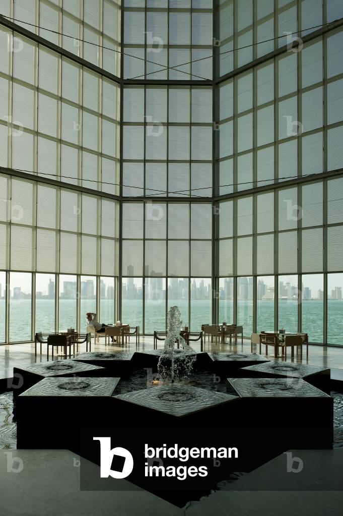 Image of Man relaxing in front of large window in the Museum