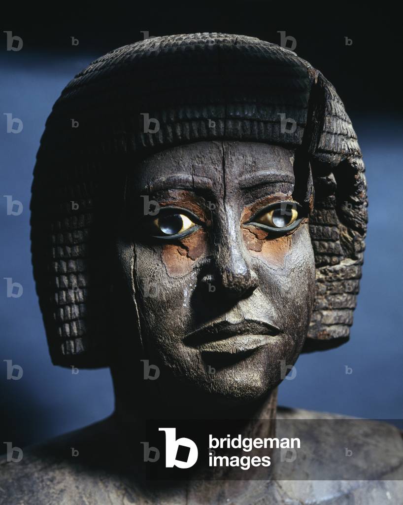 Image of Black man's face, painted wooden statue from necropolis of ...