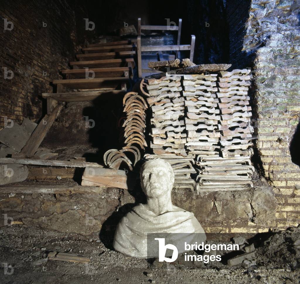 Image of Bust of male figure and roof tiles under arches of by Roman ...