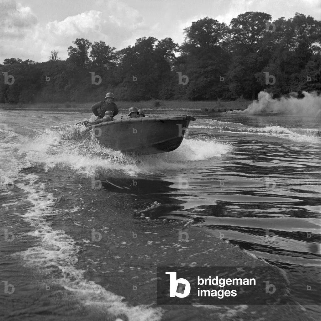 Image of Storm boat crossing a river, Germany 1940s (b/w photo)