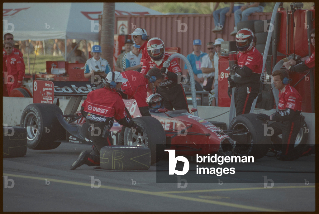 Image of American Eddie Cheever brings his damaged Lola into the pit by ...