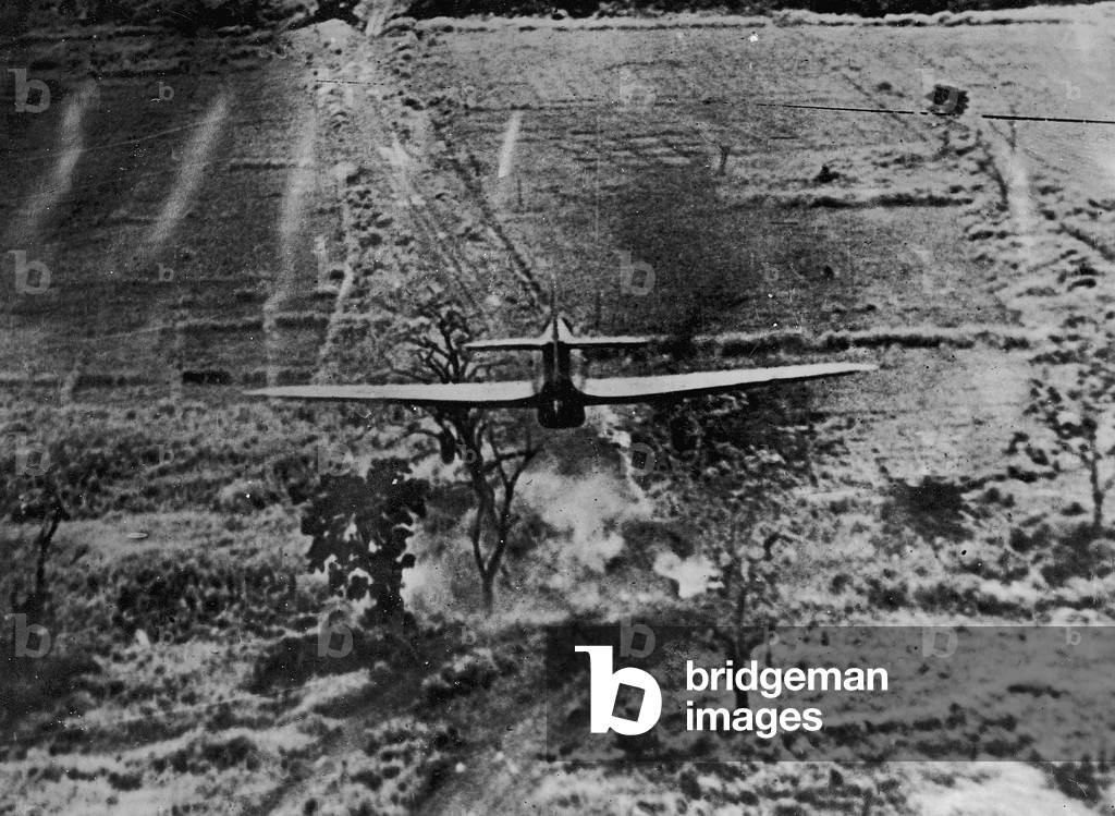 Image of An Aeroplane Bombing a Road, 1942 (b/w photo)