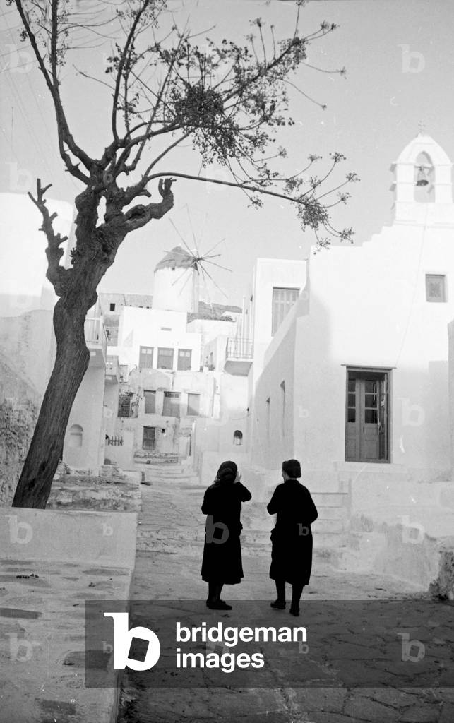 Image of Greece - Two women walk through a small village in
