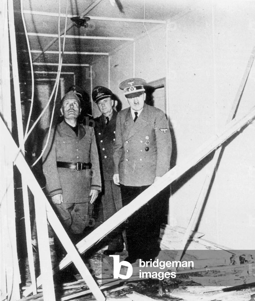 Image of Adolf Hitler shows Benito Mussolini the ruins of the barracks
