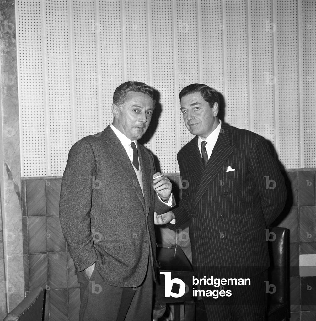 Image of Dino Risi and Claudio Gora at a film premiere, Italy,