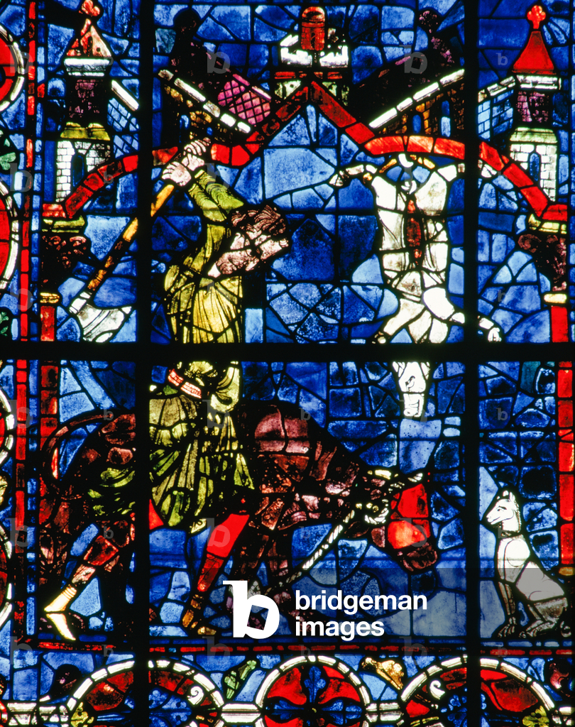 Image of Stained glass depicts butcher as he raises his ax over by ...