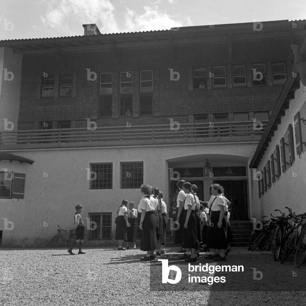 Image of BdM girls at morning line up in the courtyard of