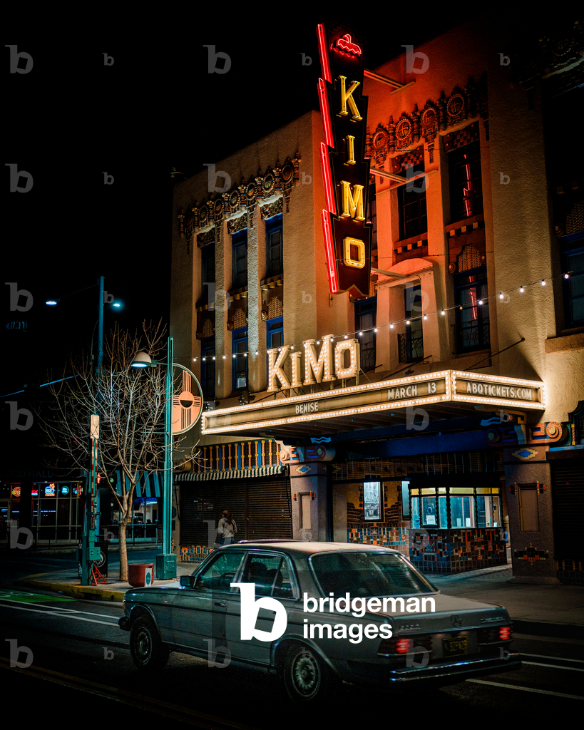 Image of Car passing Kimo Theatre at night in downtown Albuquerque, New ...