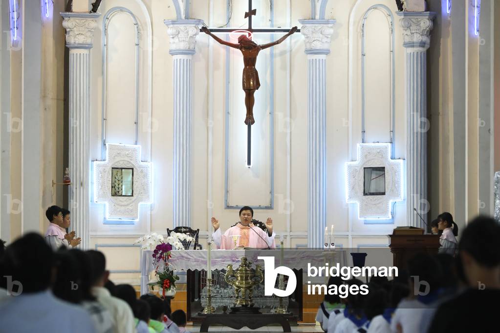Image of Sunday morning mass in a catholic church. Eucharist. Ho