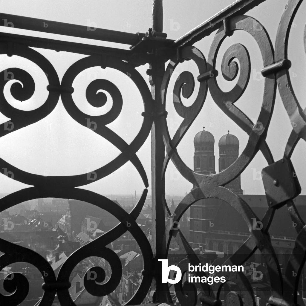 Image of View to Munich Frauenkirche church through the railing of the