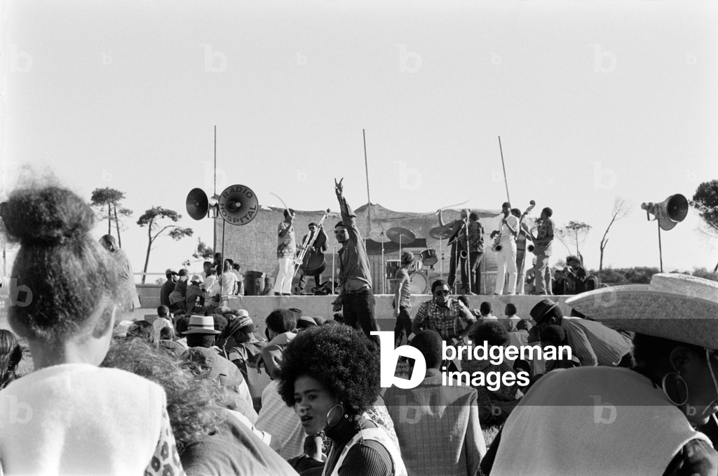 Image of Black and white photo of a crowd scene at a
