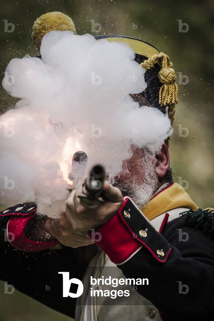 Image of Historical reenactment: Infantryman in Napoleon's army firing ...