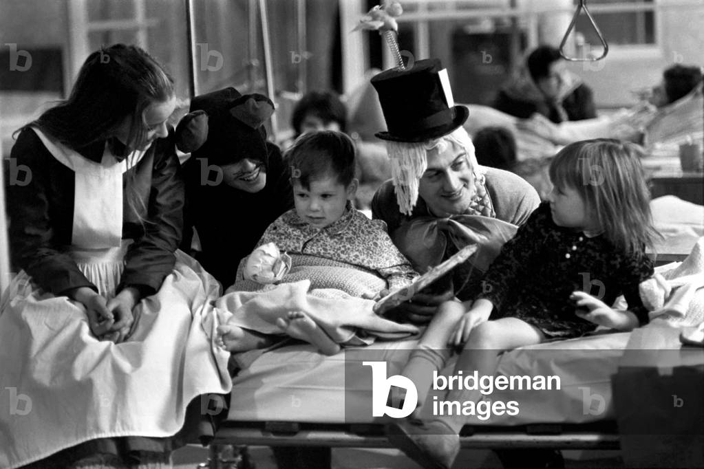 Image of Children of booth hall hospital meet character from Alice in