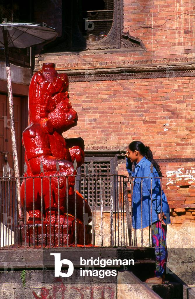 Image of Nepal: Worshipping the Hindu god Hanuman, devotee of Rama, Hanuman