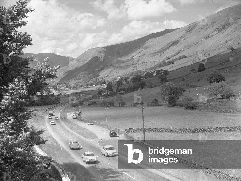 Image of A view of a road with cars on running through by Hardman ...