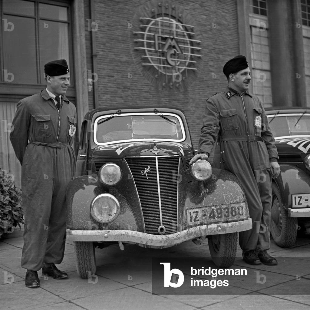 A driver team with its Ford model Eifel in front by