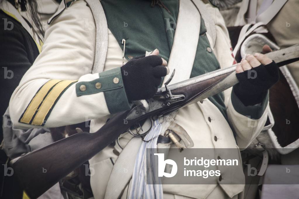 Image of Historical reenactment: French soldier loading his breech ...